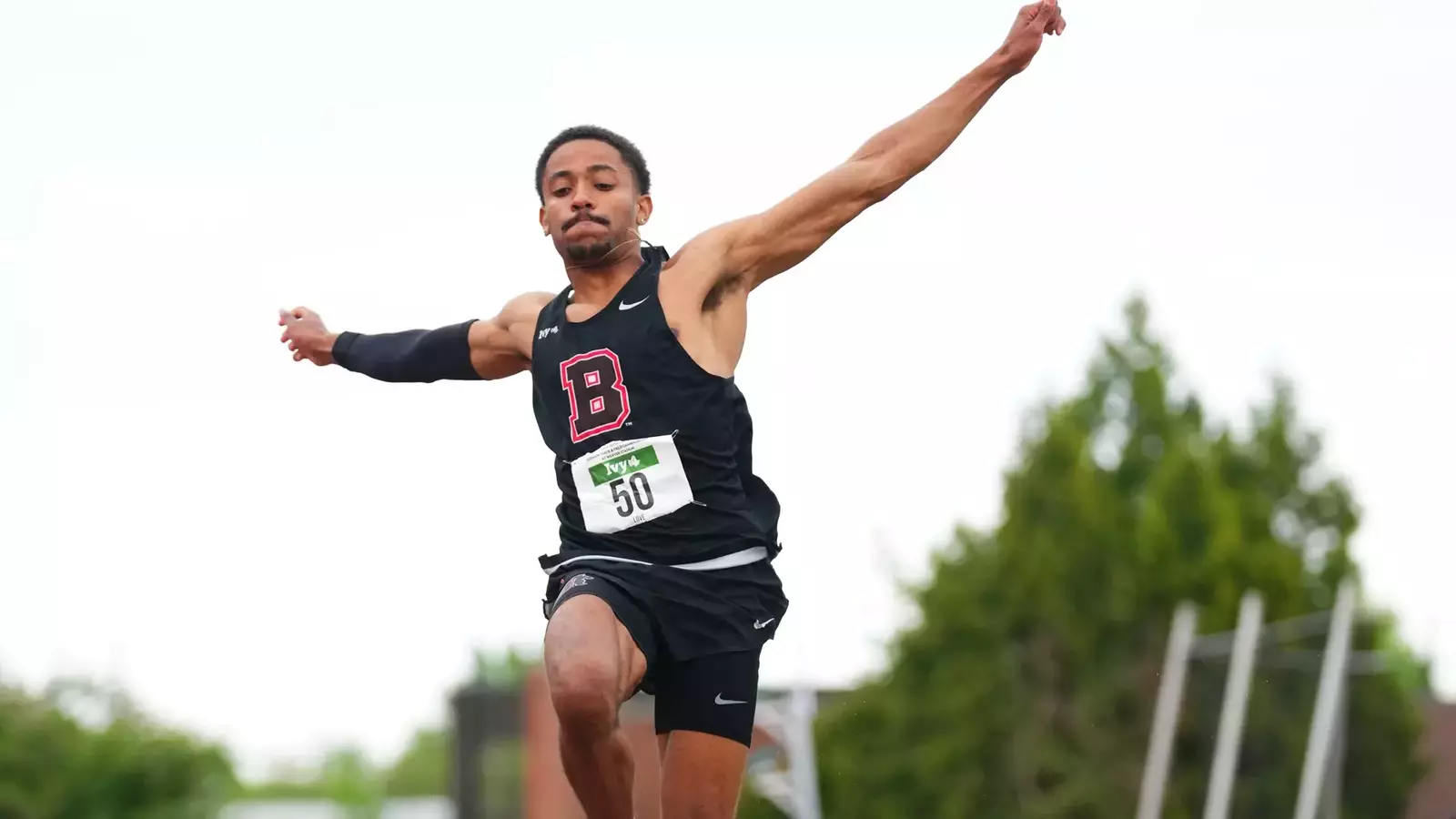 Love Captures Long Jump Title on Day One of Heps - Brown University ...
